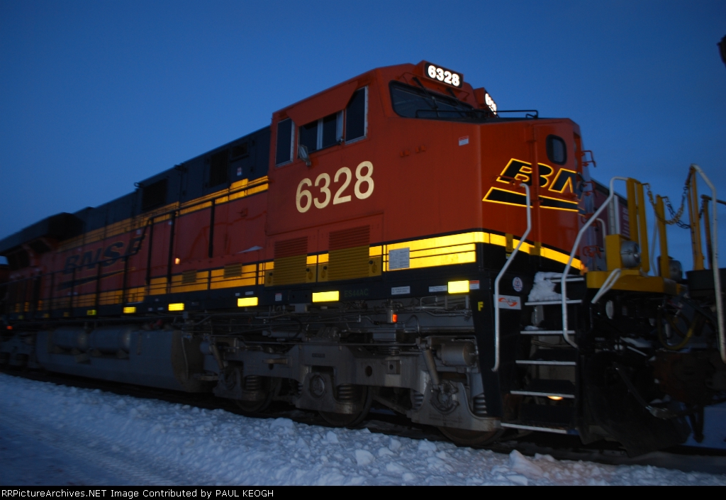 Close am flash shot of BNSF 6328 second unit on a eastbound loaded coal train.